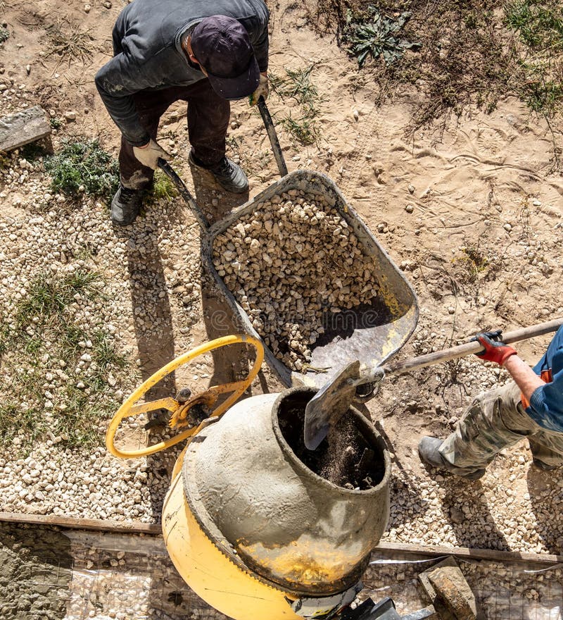 Workers Pour Concrete Solution at a Construction Site Stock Image ...