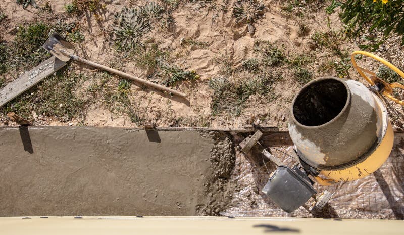Workers Pour Concrete Solution at a Construction Site Stock Photo ...