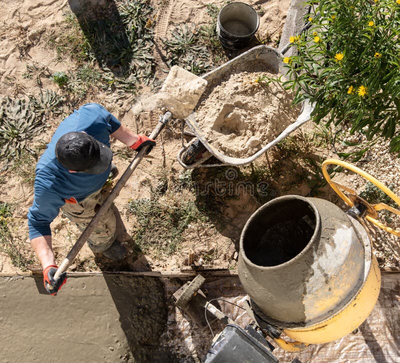 Workers Pour Concrete Solution at a Construction Site Editorial Stock ...