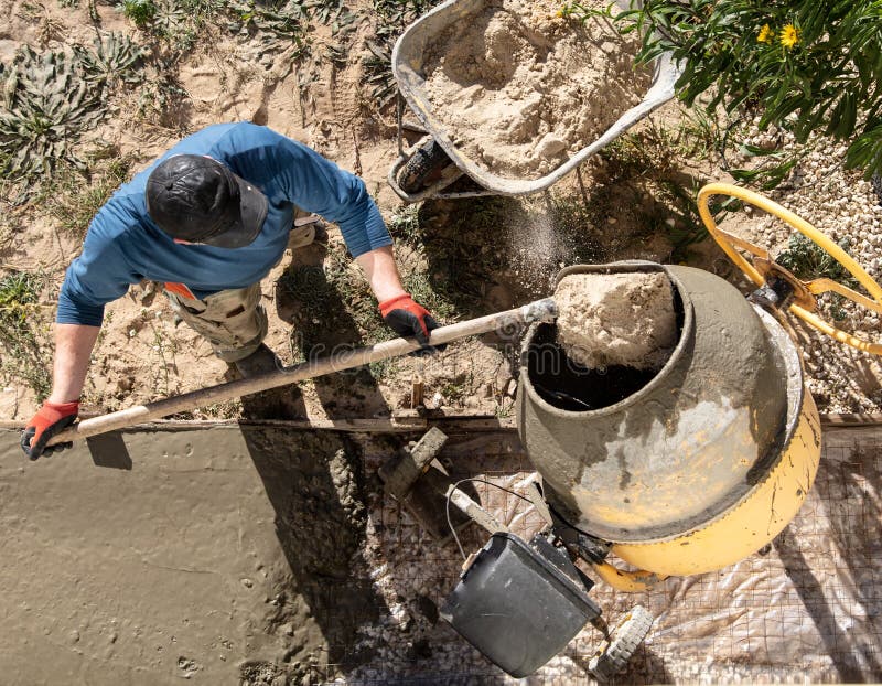 Workers Pour Concrete Solution at a Construction Site Stock Photo ...