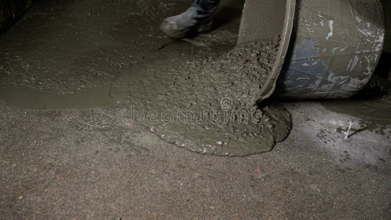 Cement Concrete. Leveling the Floor Using a Screed. Workers Pour a ...