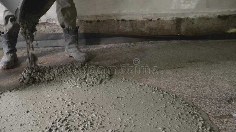 Cement Concrete. Leveling the Floor Using a Screed. Workers Pour a ...