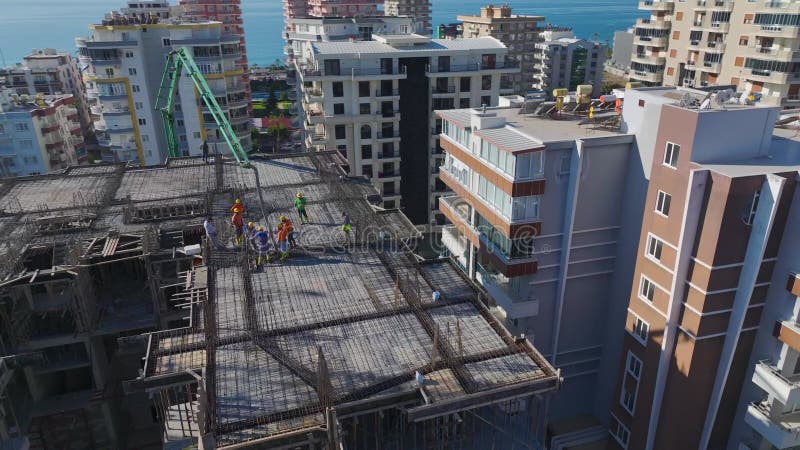 Aerial Video: Active Construction Site with Concrete Pouring, Metal ...