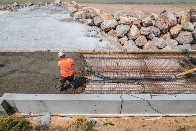 Workers Pouring a Concrete Slab on a Construction Site Stock Photo ...