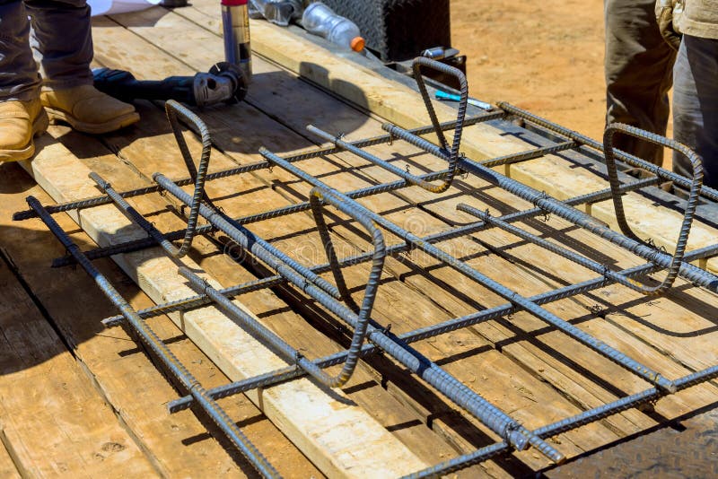 Steel Reinforcement Bars Arranged on Wooden Surface for Construction ...