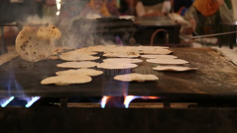 Workers Preparing Indian Bread at Public Kitchen in Amritsar. Stock ...