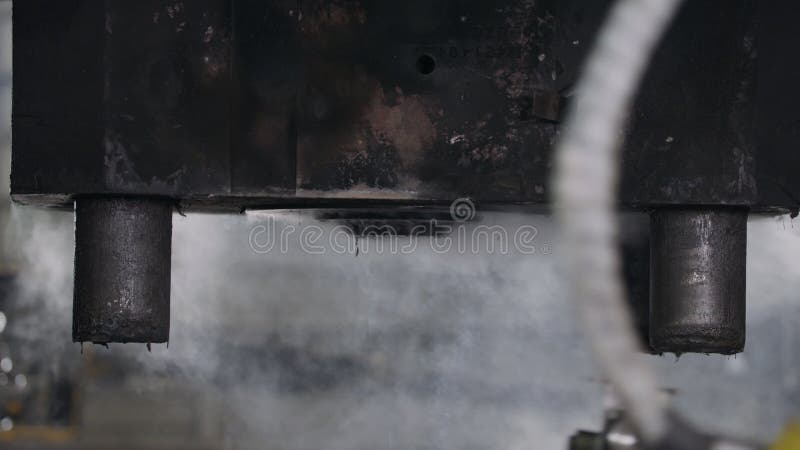 Workers Preparing an Industrial Forging Press for Work with Steam ...
