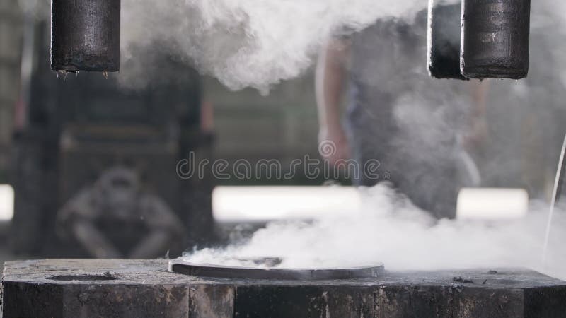 Workers Preparing an Industrial Forging Press for Work with Steam ...