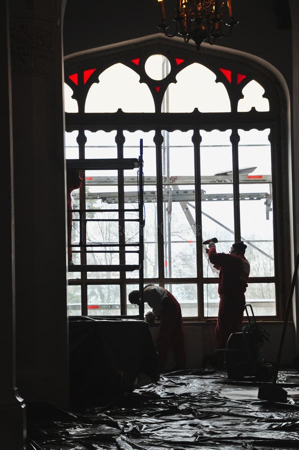 Workers in the Process of Installing or Repairing a Large, Ornate ...