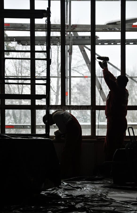 Workers in the Process of Installing or Repairing a Large, Ornate ...