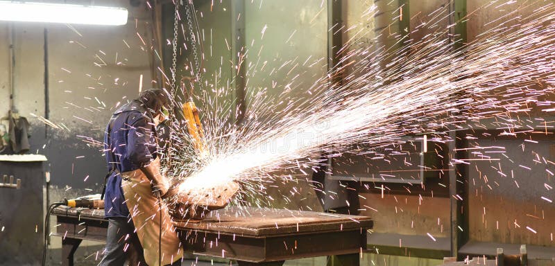 Worker With A Grinding Machine Processes A Gear Wheel - Production Of ...