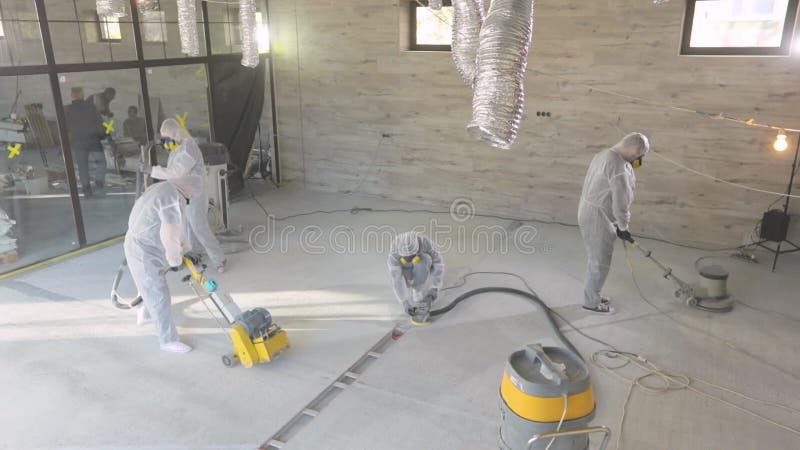 Grinding a Concrete Floor with a Grinder. Concrete Floor Processing ...