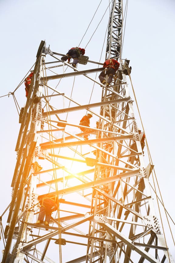 The workers of the pylon stock photo. Image of equipment - 286218266