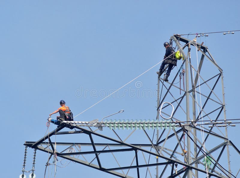 Workers on Pylon editorial image. Image of pylon, high - 100667045