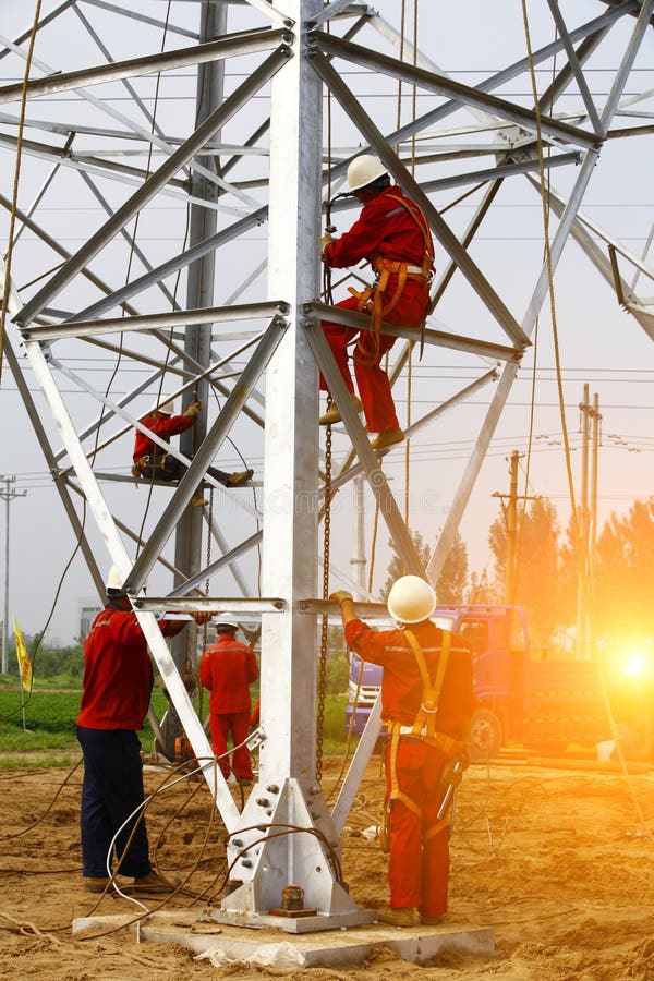 The workers of the pylon stock image. Image of technology - 349272537