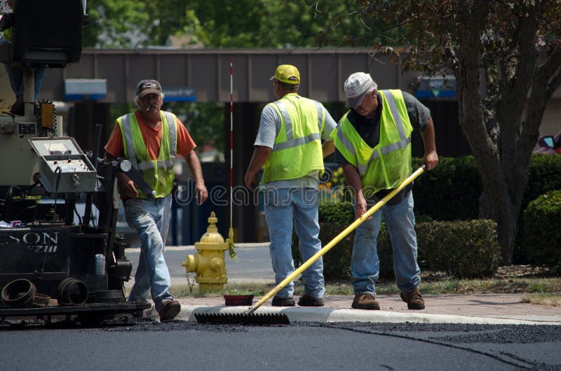 Workers raking asphalt editorial photo. Image of black - 30304661