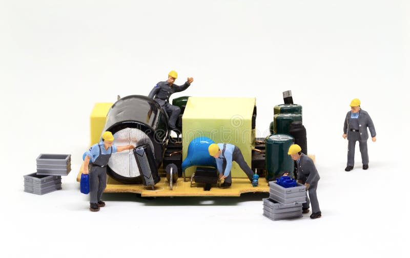 Workers Repair Computer Microchip. Miniature Worker Figurine. Men at ...