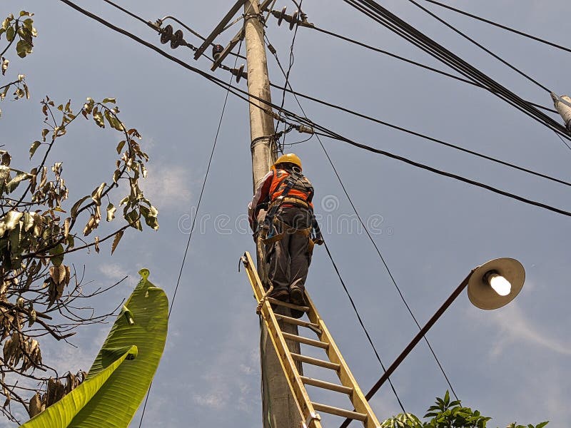 Workers Repair Low-voltage Power Lines on a Regular Basis Stock Image ...