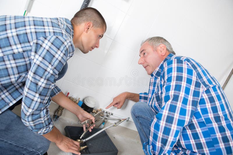 Workers Repair Pipes Boiler in Heating Room Stock Image - Image of ...