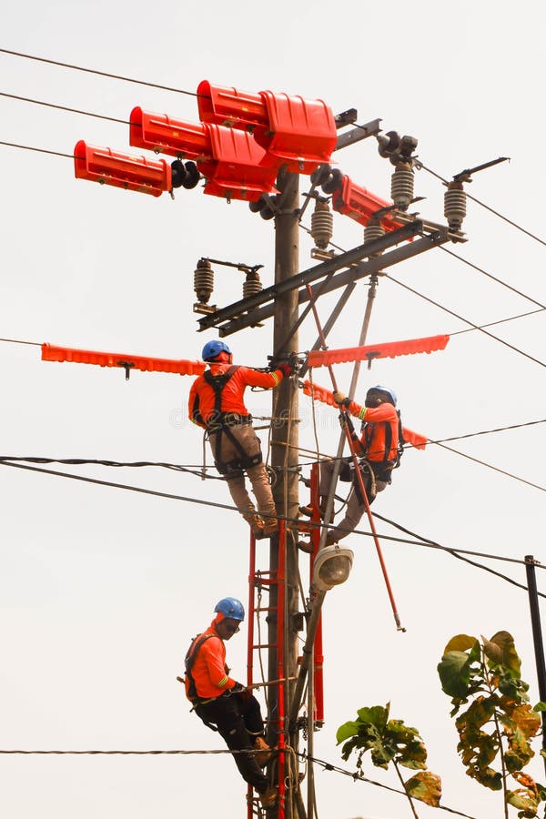 Workers Repairing an Electric Tower Editorial Stock Image - Image of ...