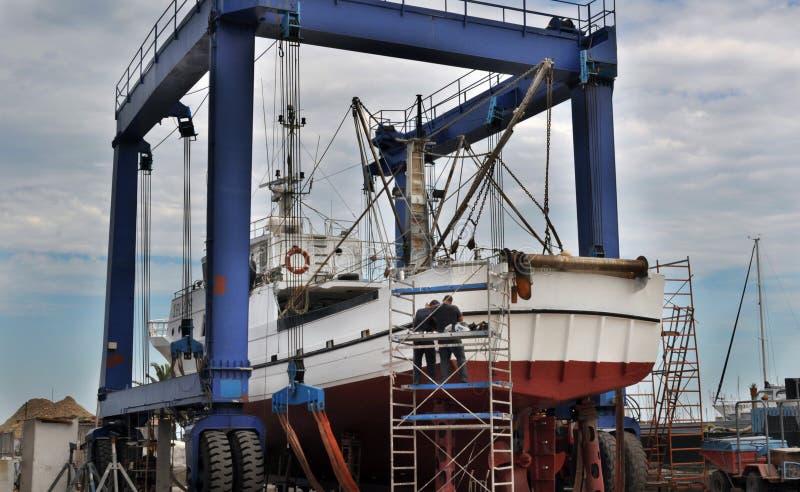 Workers Repairing a Fishing Boat Stock Image - Image of port, dock ...