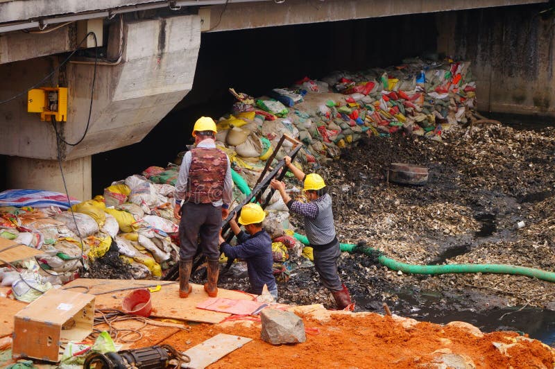 Workers in the River Construction, Pry an Iron Shelf Editorial Photo ...
