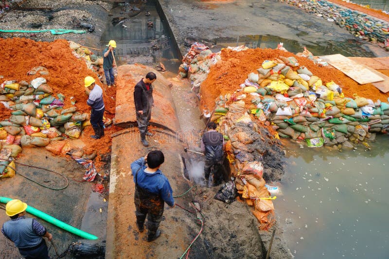 The Workers are on the River Drainage Pipeline Maintenance Editorial ...