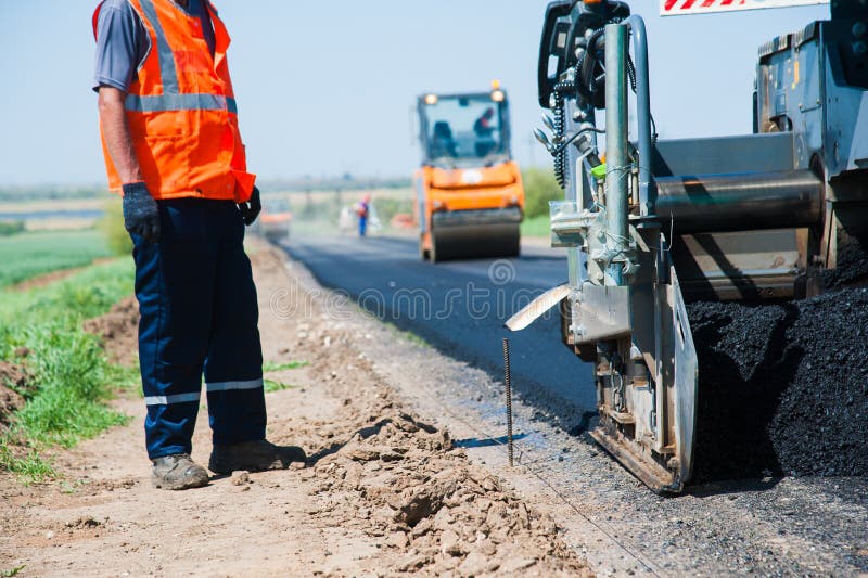 Workers on a Road Construction Stock Image - Image of street, industry ...