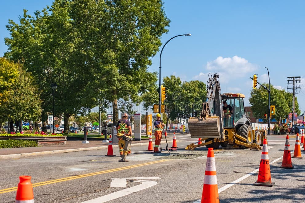 Workers on a Road Construction, Industry and Teamwork. Road Workers and ...