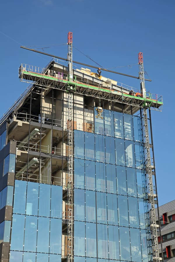 Workers on a Scaffolding of a Construction Site of a Glass Facade Stock ...