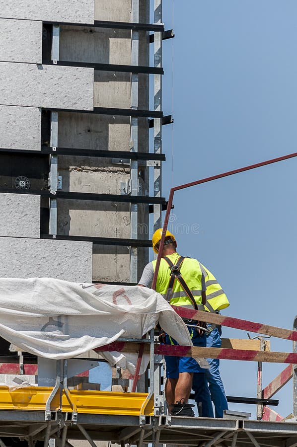 Workers on scaffolding stock image. Image of contractor - 109074185