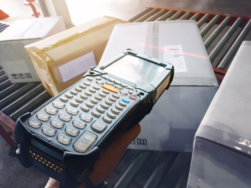 Workers Scanning Bar Code Scanner with Package Boxes on Conveyor Belt ...