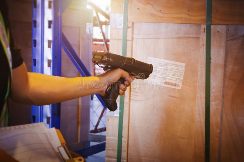 Workers Scanning Bar Code Scanner on Package Label. Storage Shipping ...