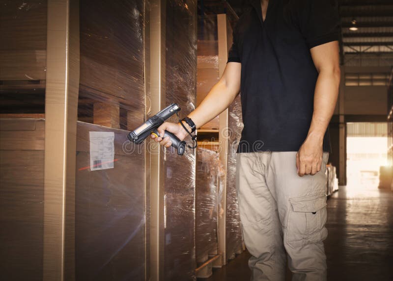 Workers Scanning Bar Code Scanner on Packaging Boxes. Shipping ...