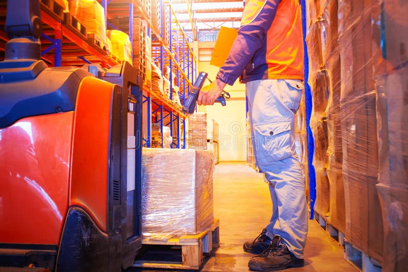 Workers Scanning Barcode Scanner on a Package Boxes. Storage Warehouse ...