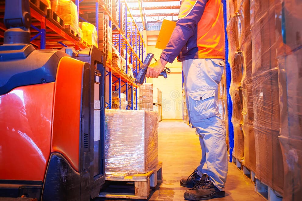 Workers Scanning Barcode Scanner on a Package Boxes. Storage Warehouse ...