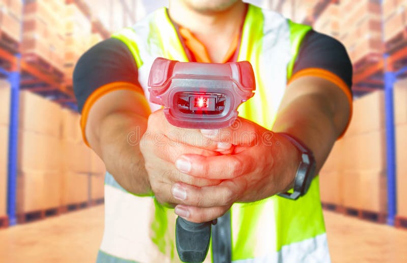 Workers Scanning Barcode Scanner with a Red Laser. Storage Warehouse ...