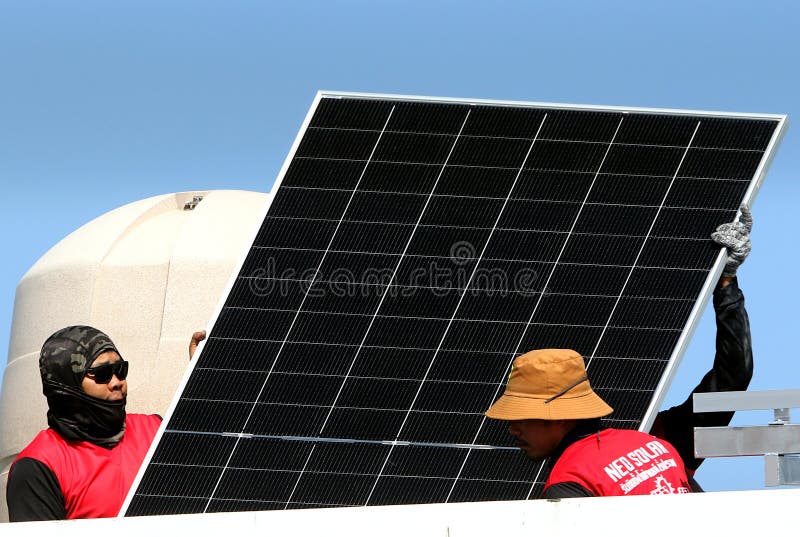 Workers Set Up Solar Panel System on Rooftop. Editorial Photography ...