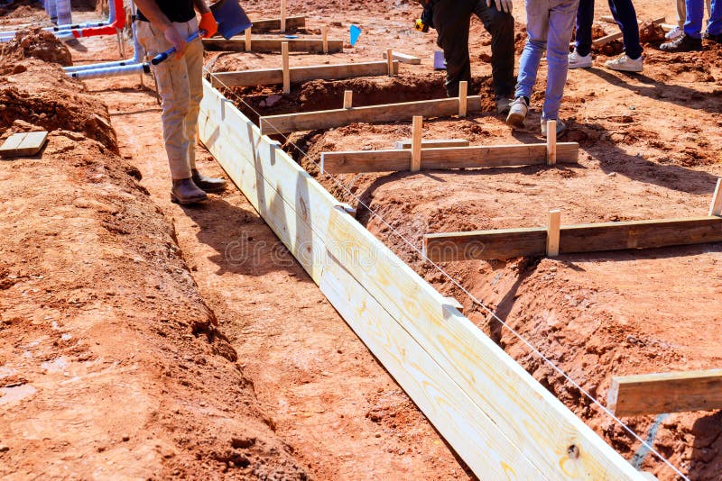 Construction Workers Prepare Foundation at Building Site during Work ...