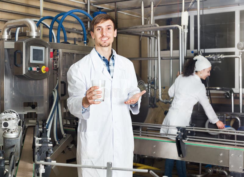 Workers Showing Dairy Production Process Stock Photo - Image of adult ...