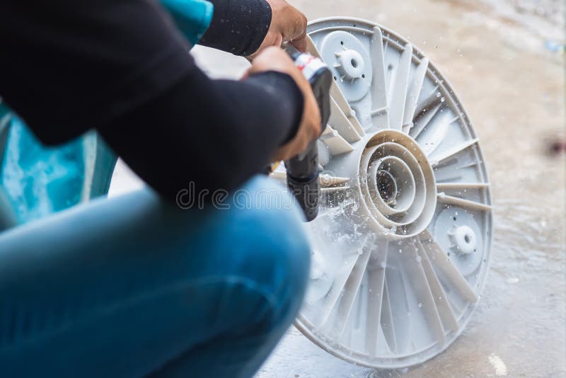 The Workers are Spraying Water To Clean the Parts of the Washing ...