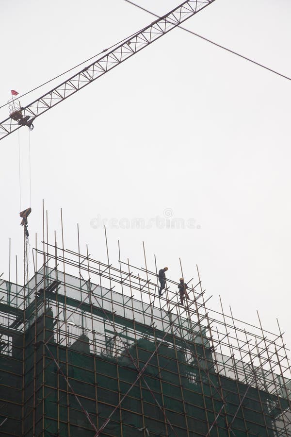 Workers Standing in a Construction Site To Work Safely on High Ground ...
