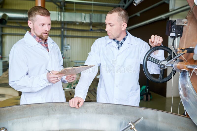 Workers Standing at Roasting Machine in Workshop Stock Image - Image of ...