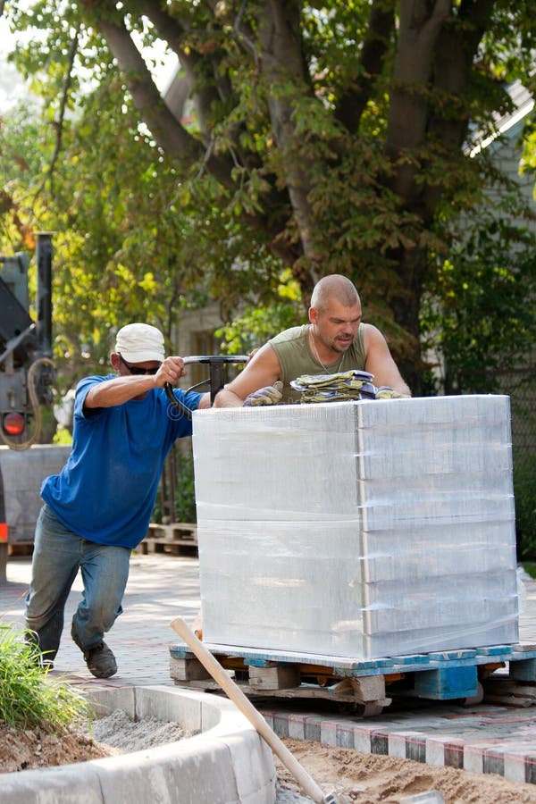 Workers on street stock image. Image of pavement, pack - 22222089