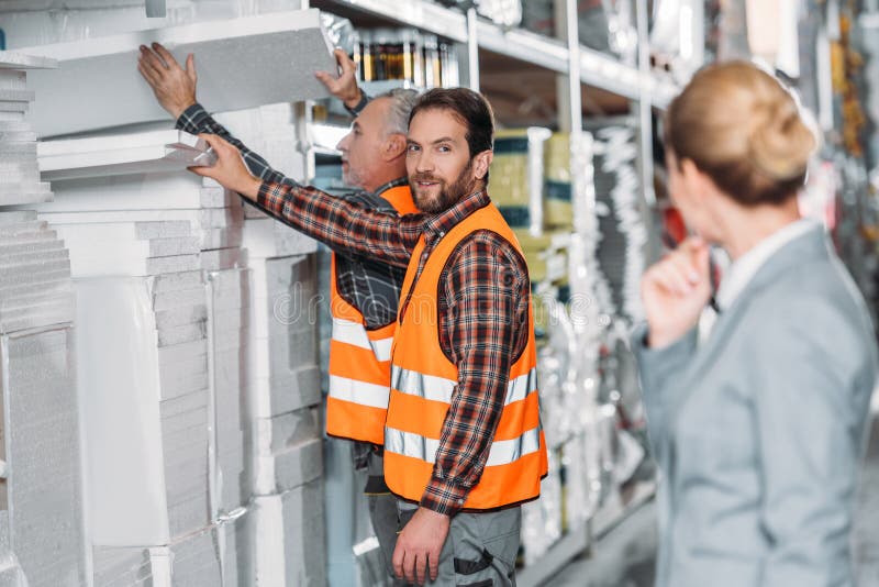 Workers with Styrofoam Inspector Standing on on Foreground Stock Image ...