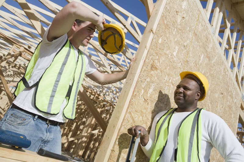 Workers Taking Break at Site Stock Image - Image of hardhat, structure ...