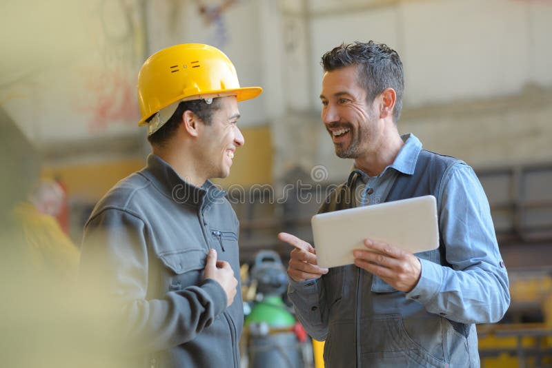 Workers Talking and Laughing at Factory Stock Photo - Image of person ...