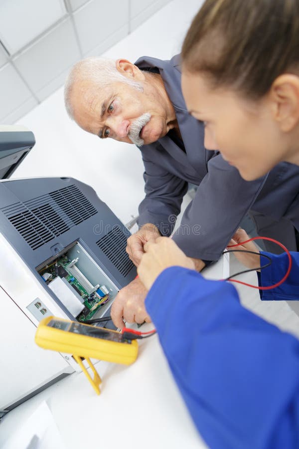 Workers Testing Appliance with Multimeter Stock Photo - Image of ...
