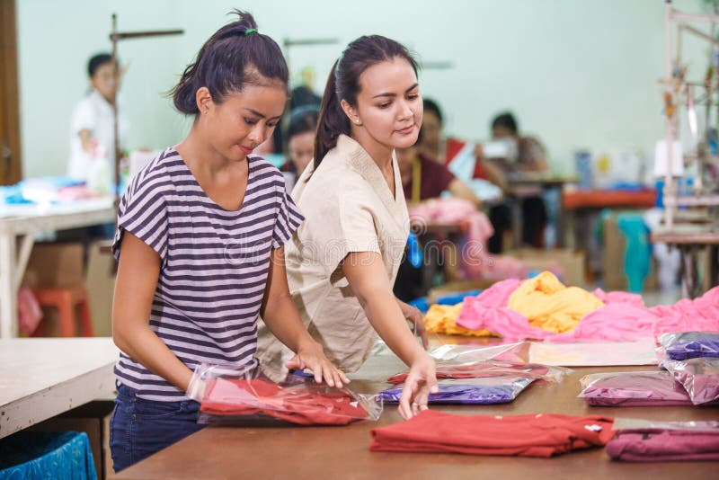 Workers at Textile Factory Packaging Their Products Stock Image - Image ...