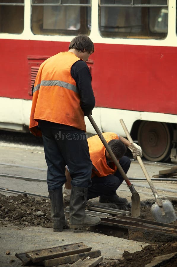 Workers on the tram-lines stock photo. Image of crew, repair - 1083370
